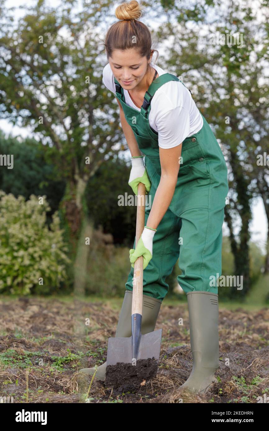 woman digging the ground Stock Photo - Alamy