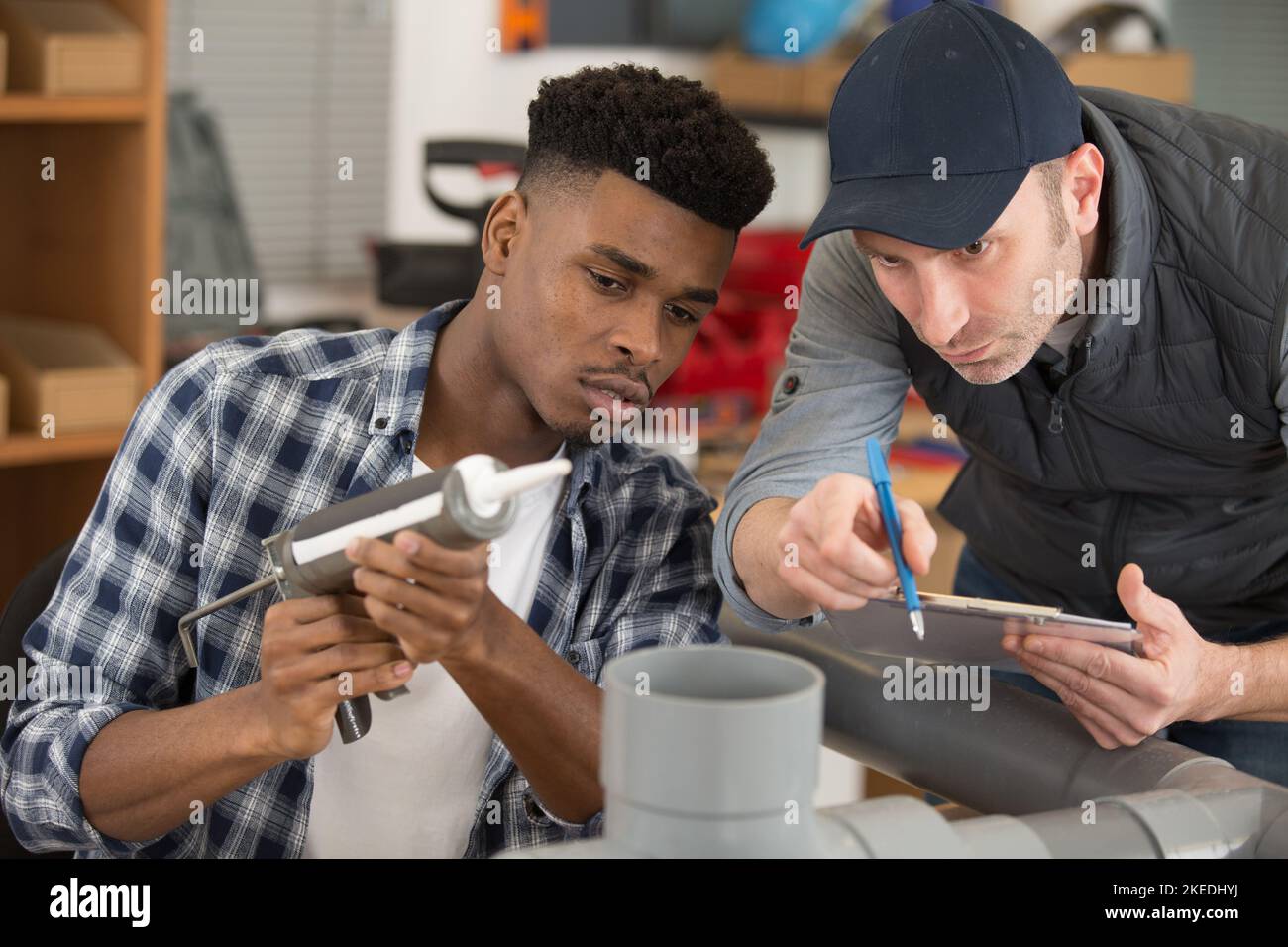 Young worker plastic pipes hi-res stock photography and images - Alamy