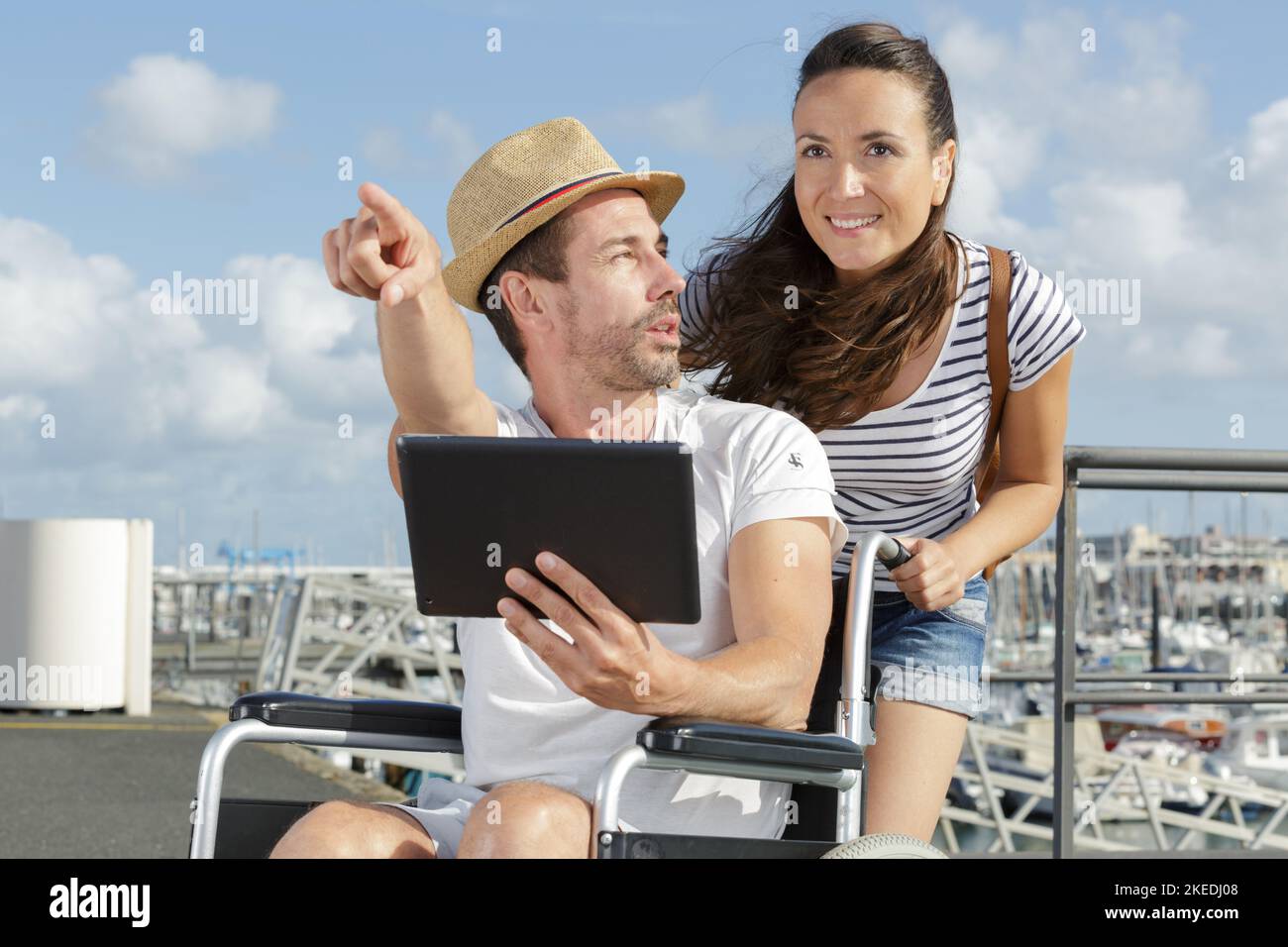 man in wheelchair pointing into distance Stock Photo - Alamy
