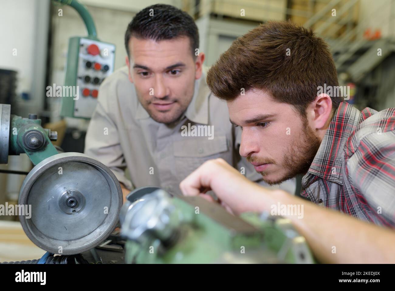 a portrait of metal lathe maintenance workers Stock Photo - Alamy