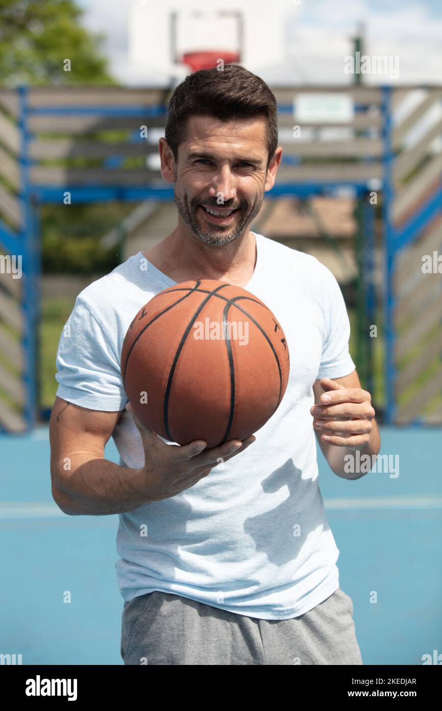 handsome male playing basketball outdoor Stock Photo - Alamy