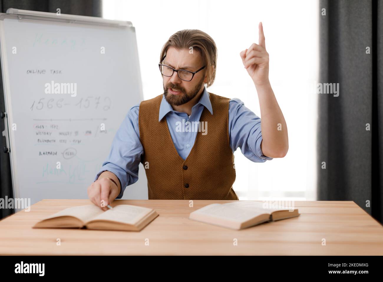 Lecturer having online tutorial Stock Photo - Alamy