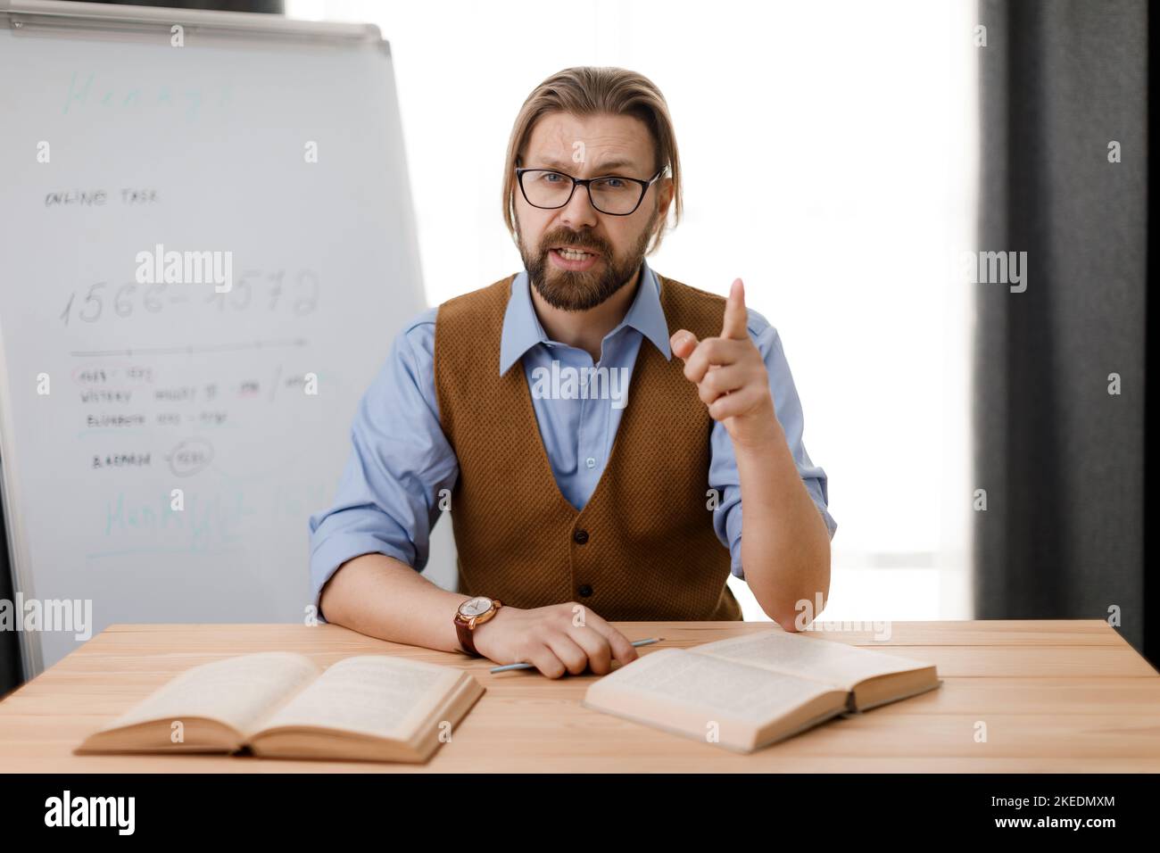 Tutor at home during lecture Stock Photo - Alamy