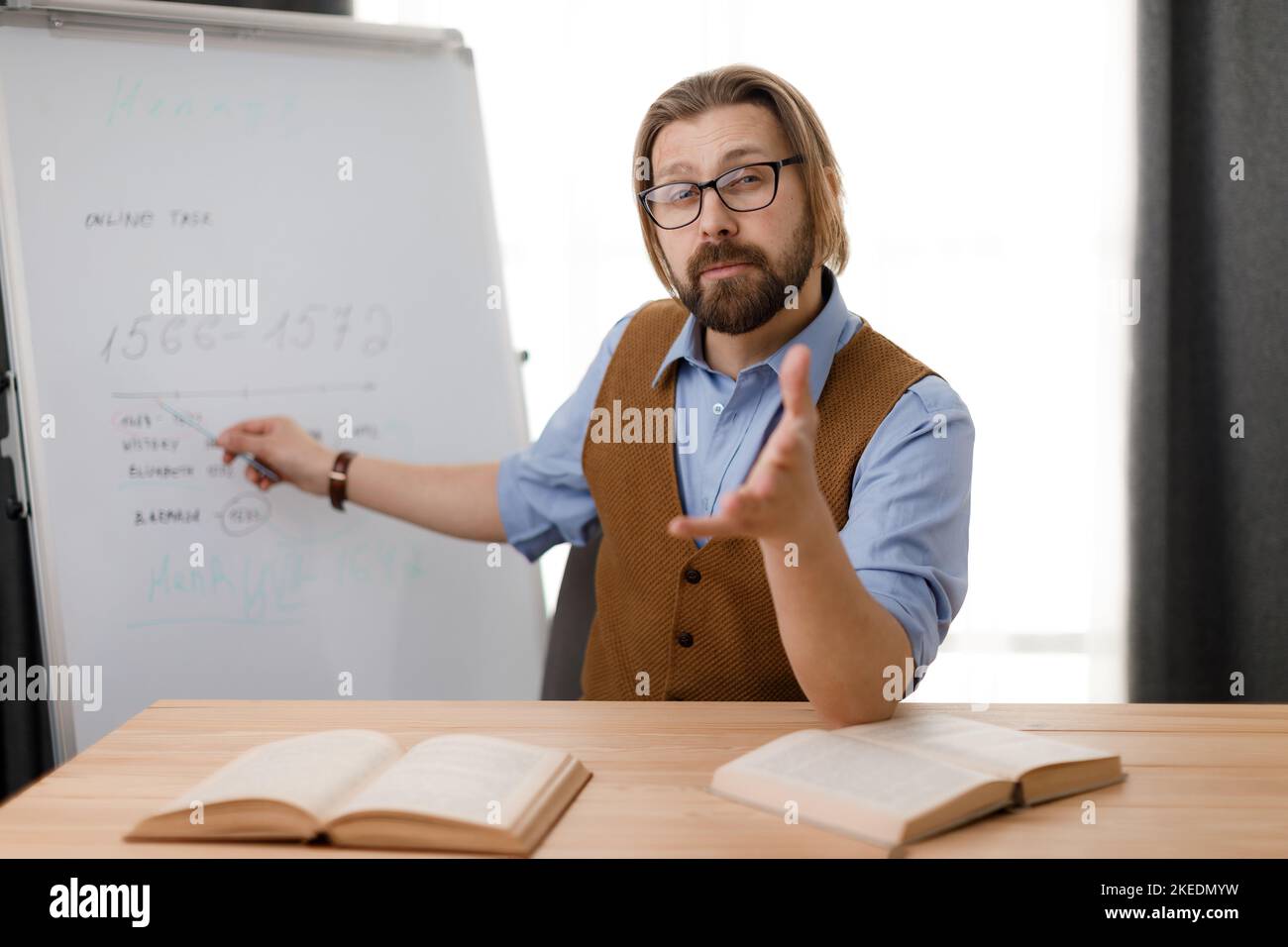 Teacher having online lecture Stock Photo - Alamy