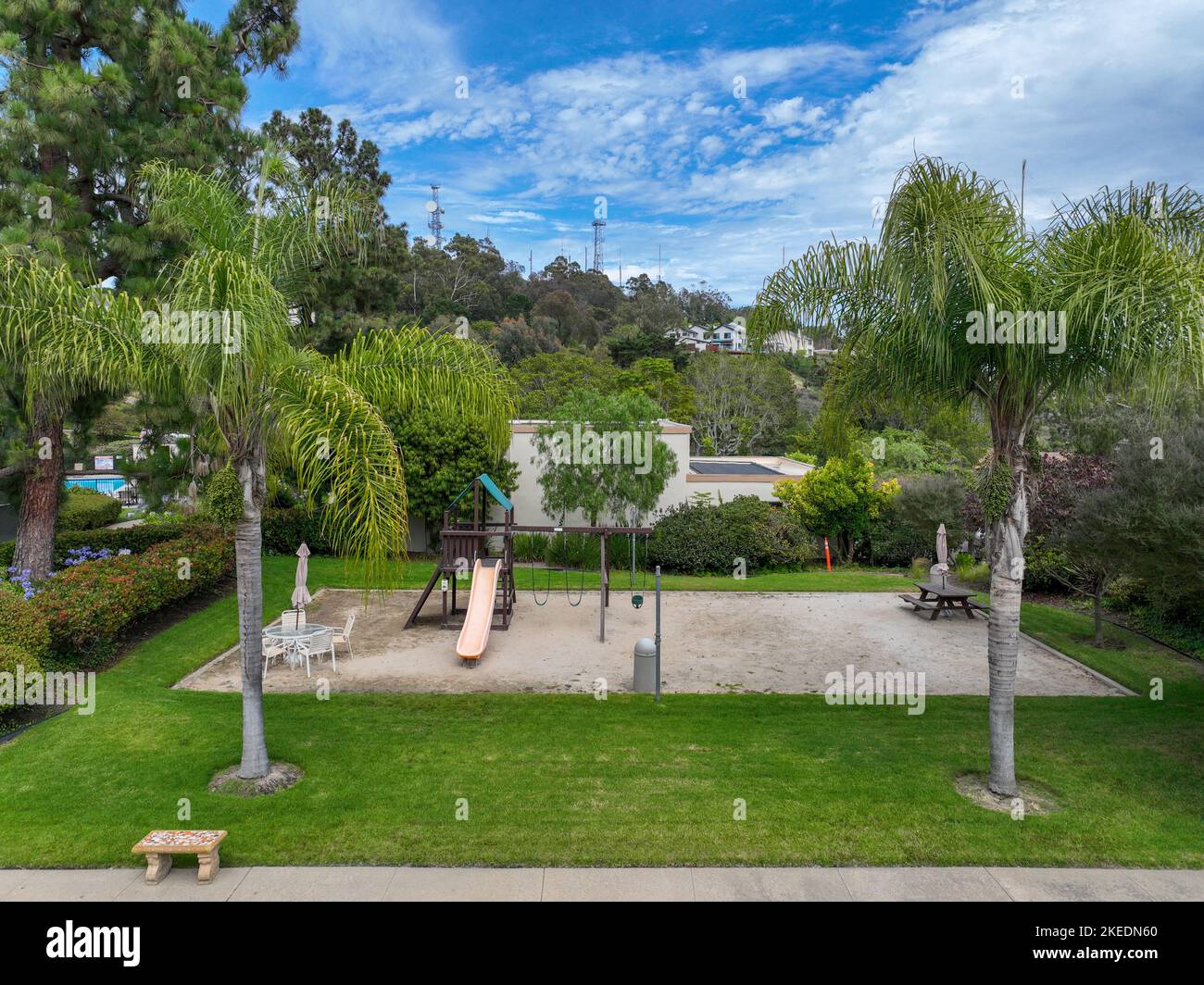Aerial view of recreational facilities with kids playgorund in private ...