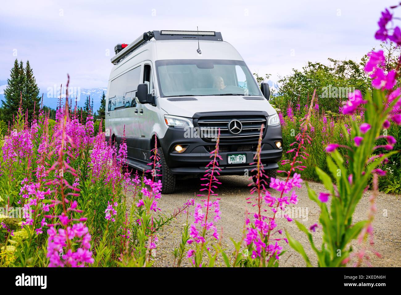 Senior woman driving Airstream Interstate 24X 4WD campervan; Fireweed ...