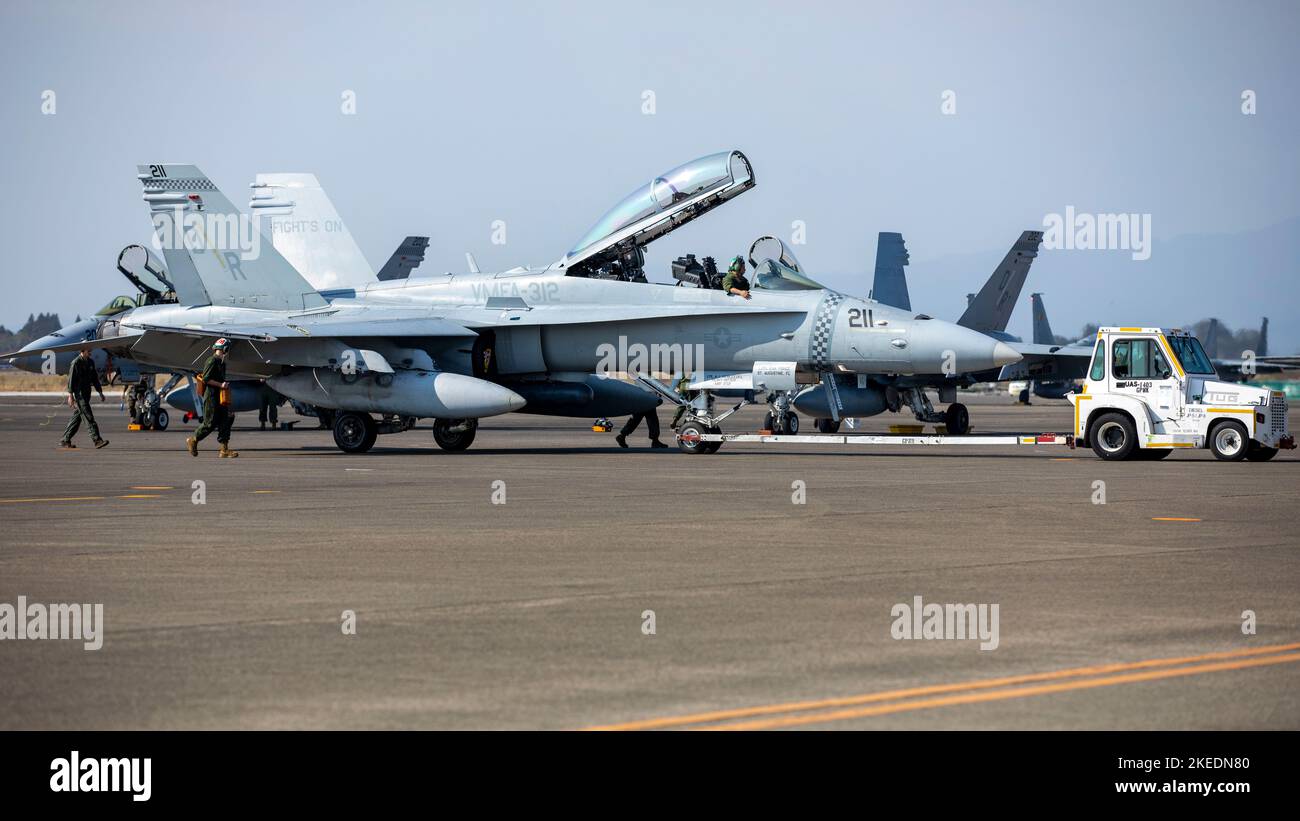 U.S. Marines with Marine Fighter Attack Squadron (VMFA) 312 tow an F/A ...