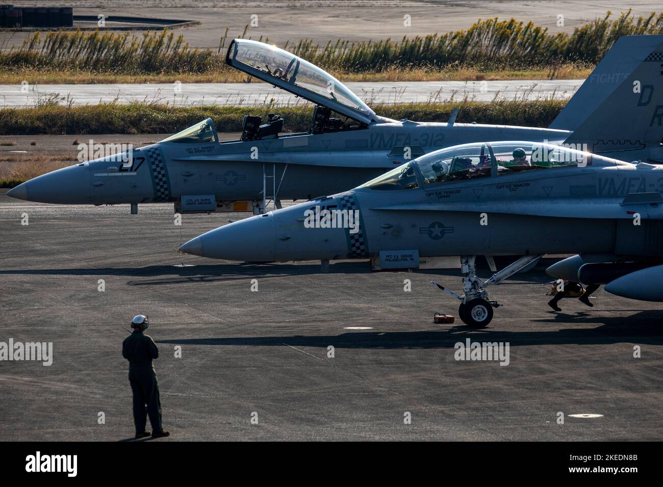 U.S. Marine Corps F/A-18D Hornet aircraft stage on the flight line at ...