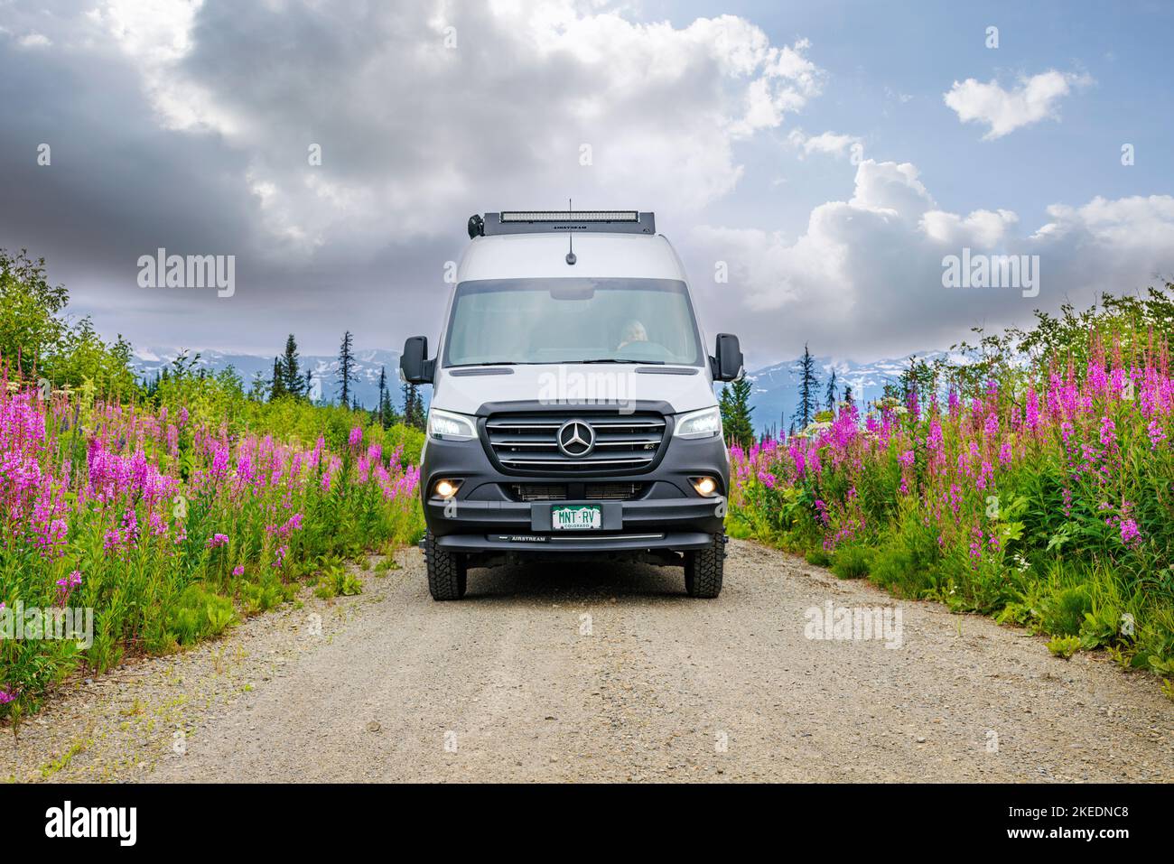 Senior woman driving Airstream Interstate 24X 4WD campervan; Fireweed ...
