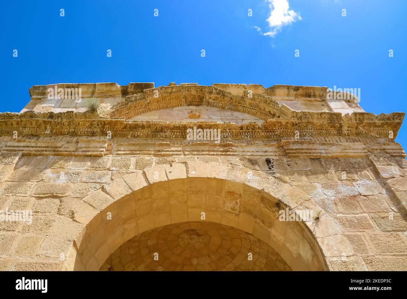 A low angle shot of the top of Hadrian's Arch, the arched gate of the ...