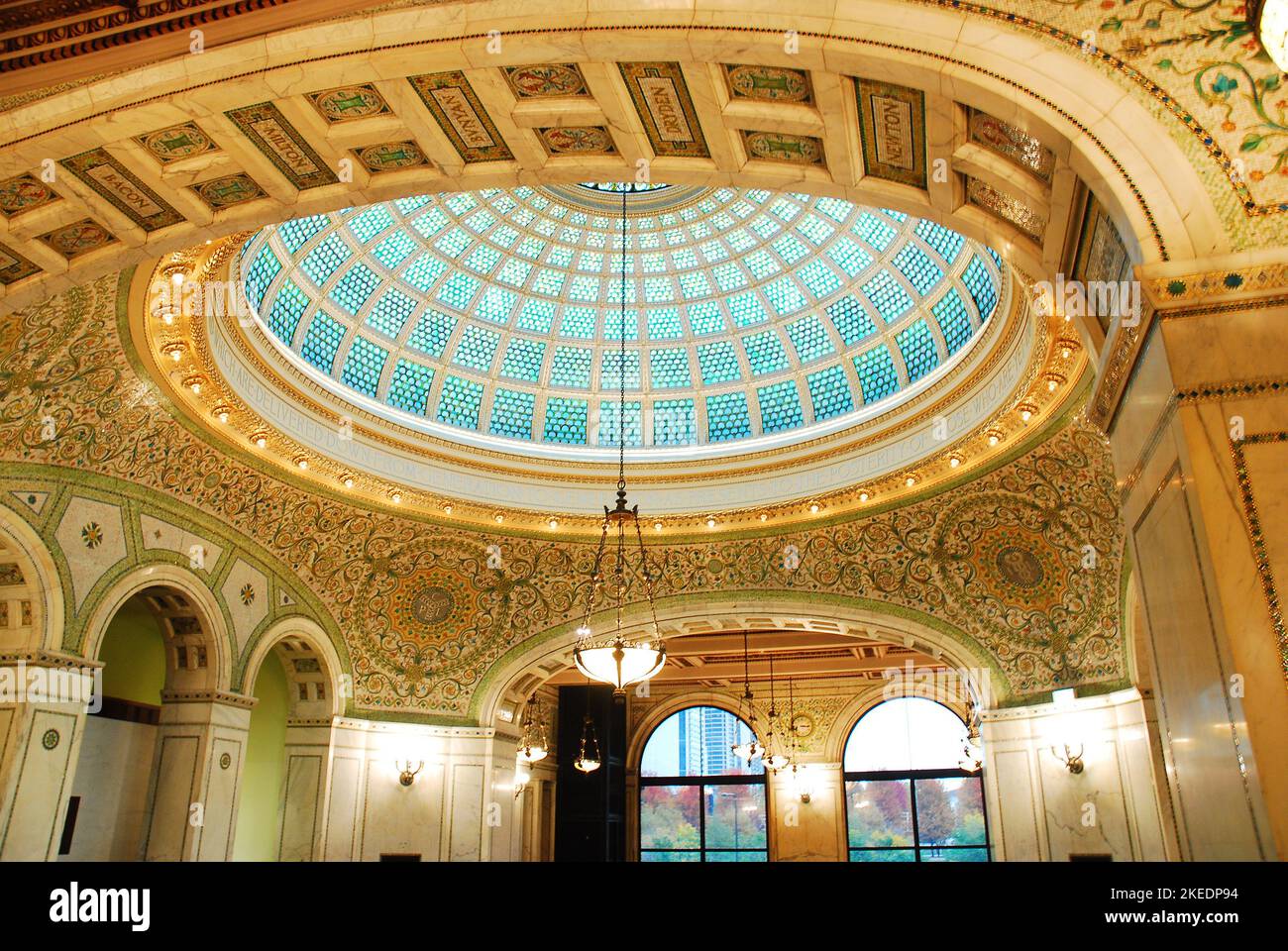 A large circular Tiffany stained glass window is situated over the ... A large circular Tiffany stained glass window is situated over the ...