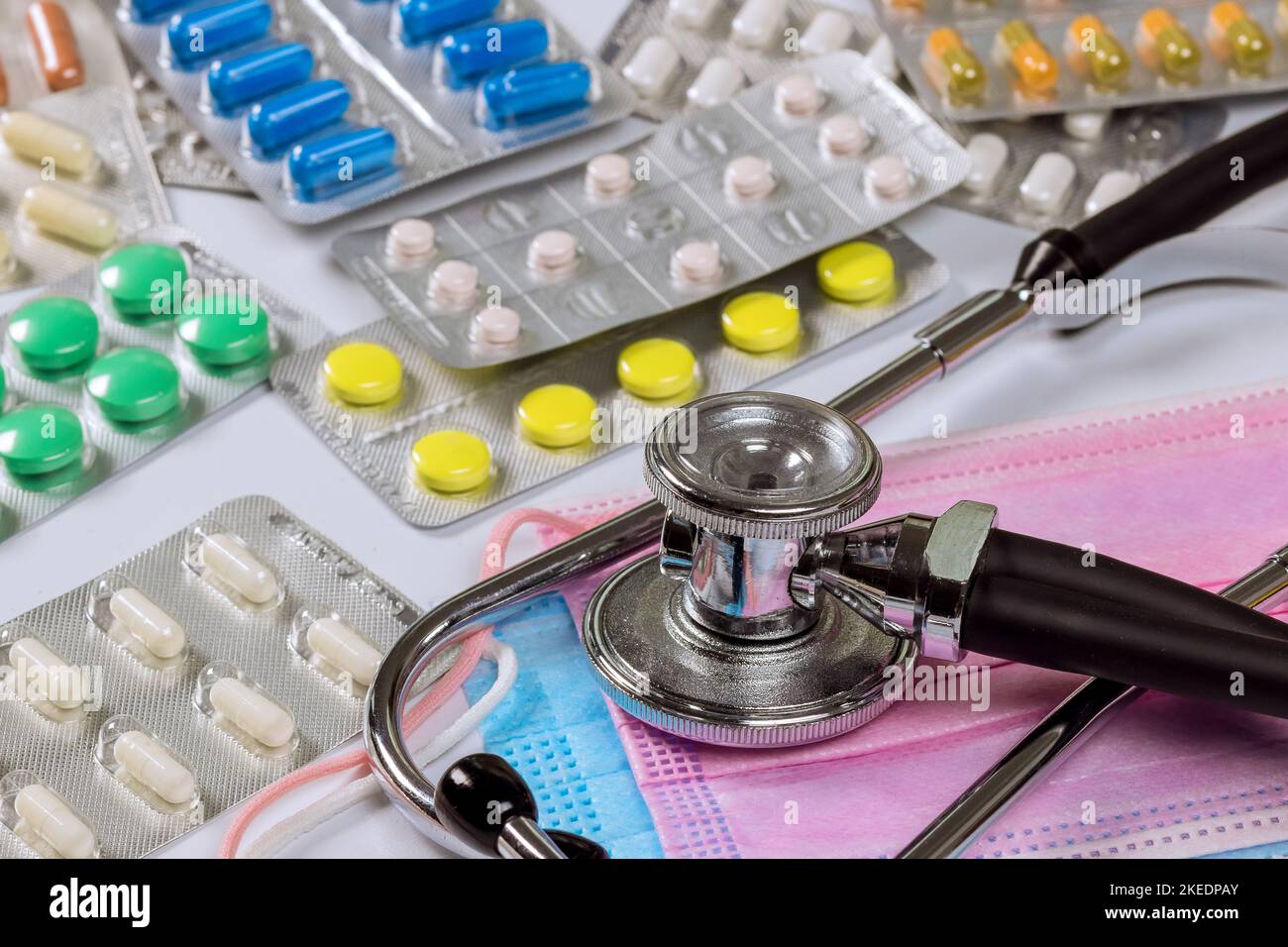 This is doctors office desk with stethoscope and of blister packs ...