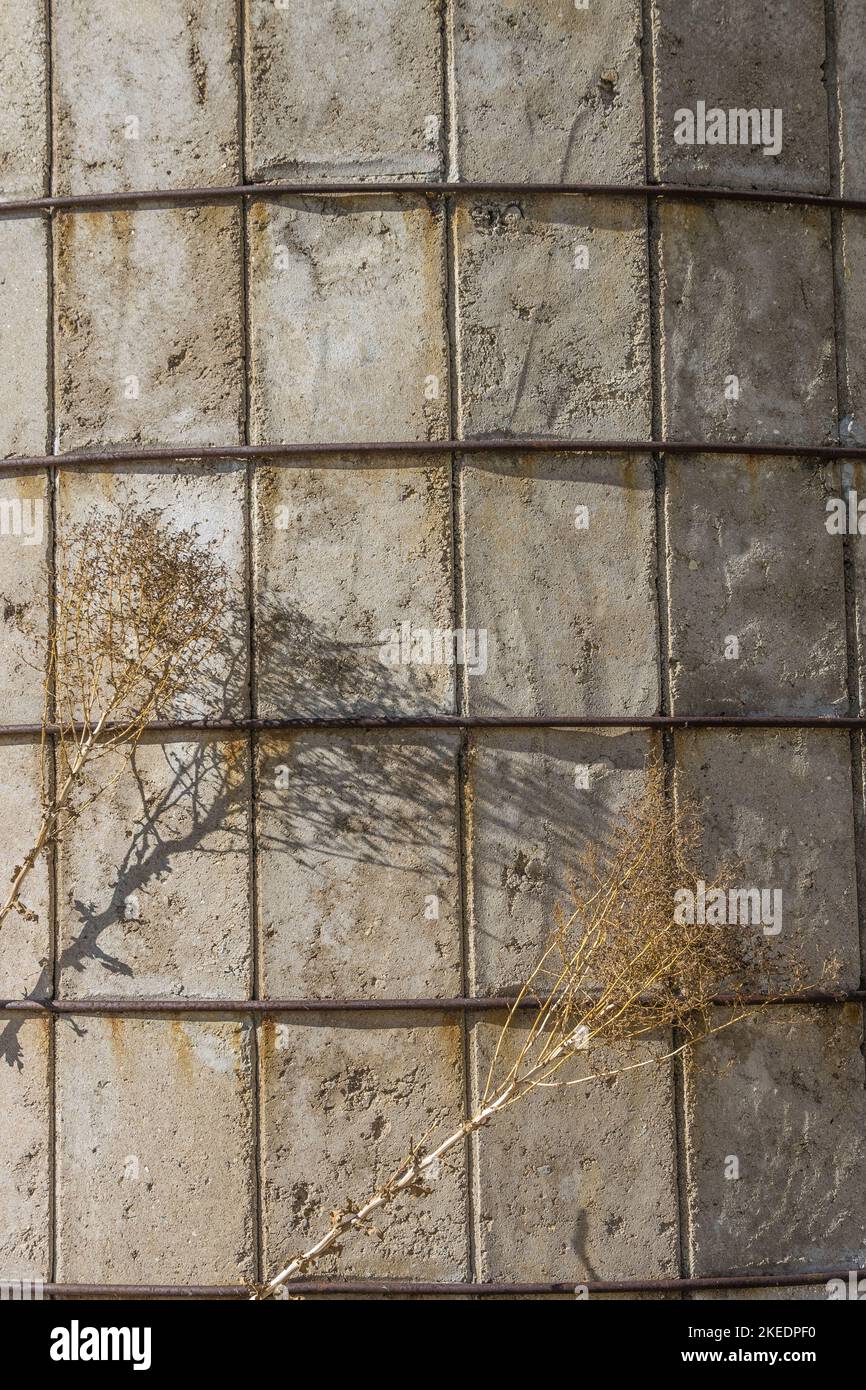 A detail of an old-fashioned silo constructed out of concrete blocks ...