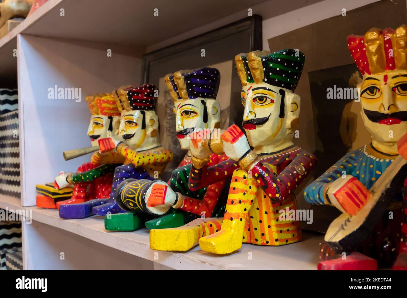 Colorful wooden Rajasthani toys holding musical instruments are being ...