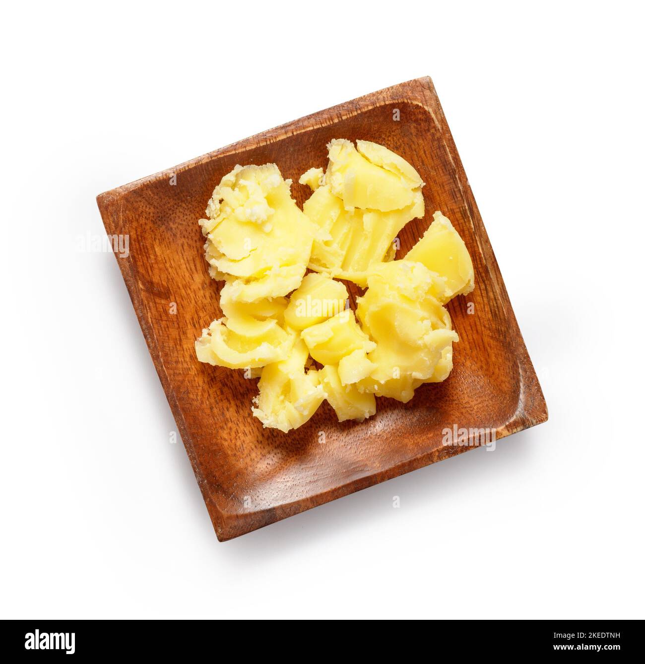 Ghee butter on wooden plate isolated. Butter Ghee on white background ...