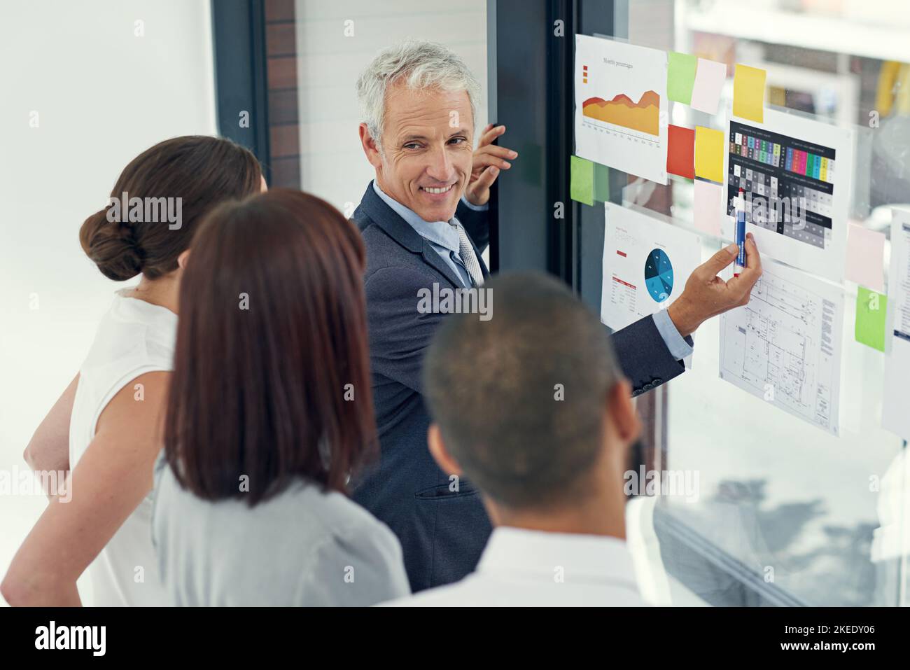 Hes got their full attention now. a group of businesspeople looking at ...