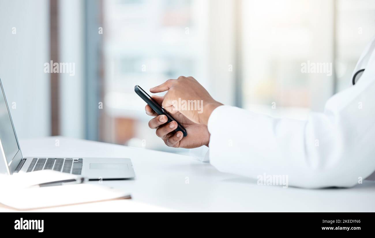 doctor, laptop and hands with phone for online communication in ...