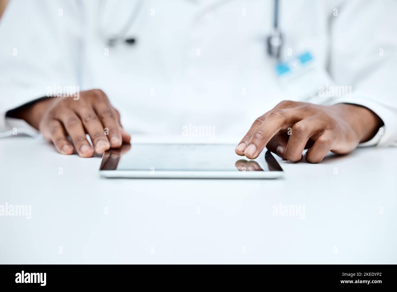 Tablet, desk and hands of doctor working on medical project, healthcare ...