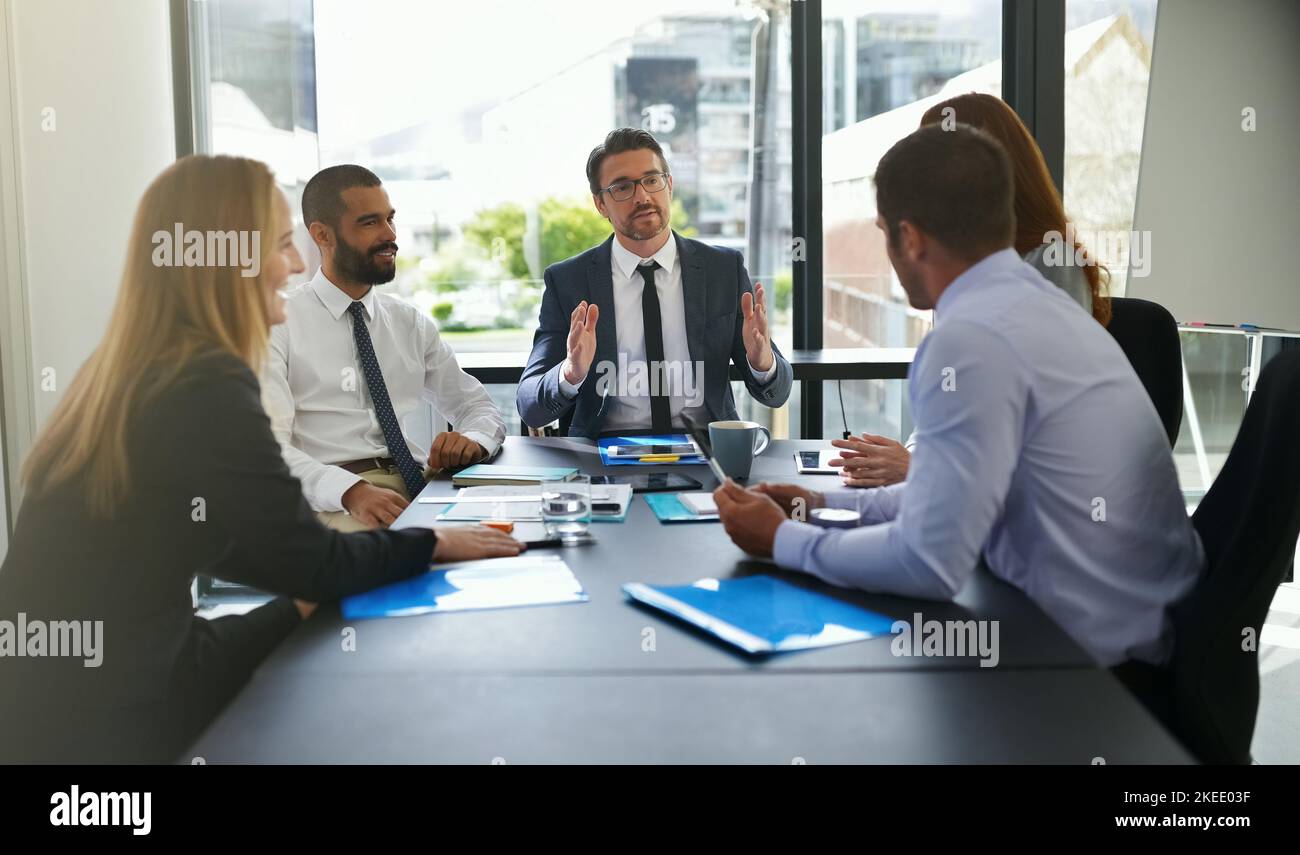 Explaining his vision. businesspeople in a meeting Stock Photo - Alamy