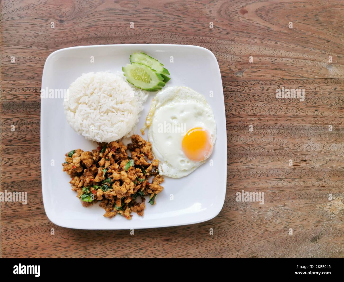 Pad kra pao gai or stir fried chicken with Thai basil, fried egg and ...