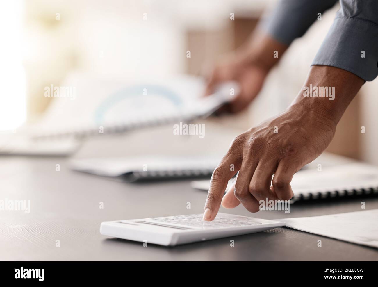 Hand with calculator hi-res stock photography and images - Alamy