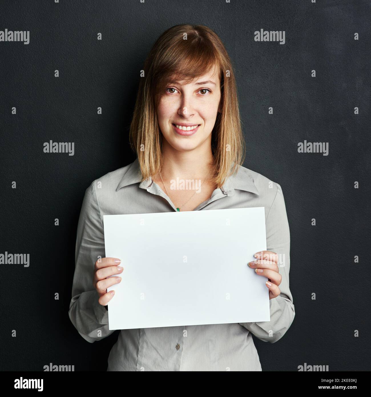 I endorse this message. Studio portrait of a young woman holding a ...