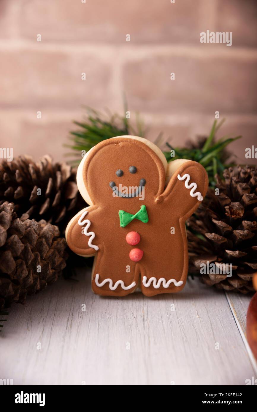 Christmas Homemade gingerbread man cookie waiving a hand saying hello ...