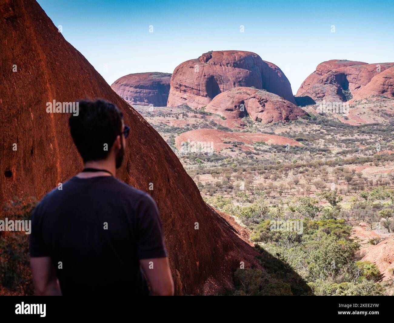 A young Australian man exploing rock formations in a canyon park in ...