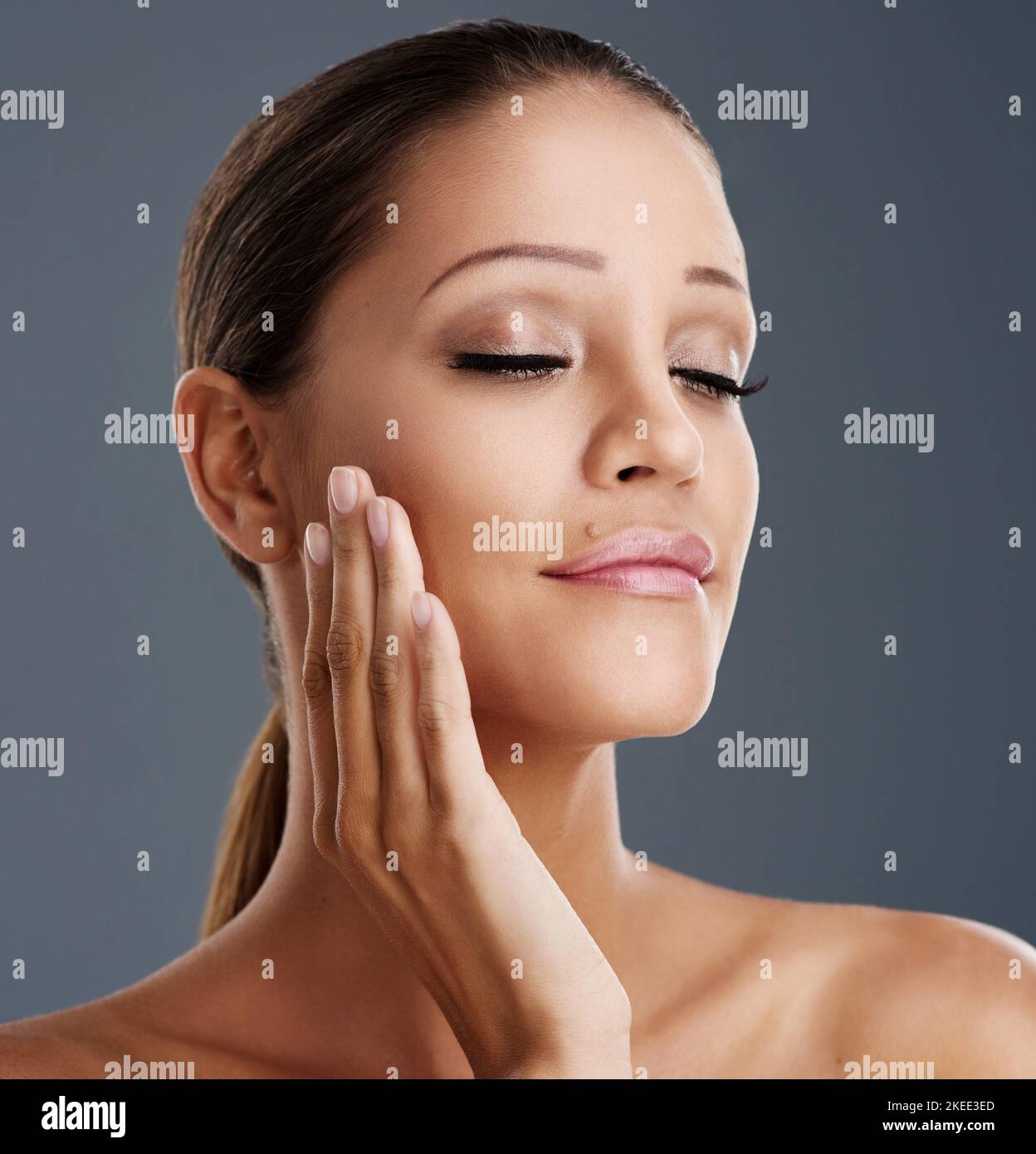 Loving her skin like it deserves to be. a beautiful young woman posing ...