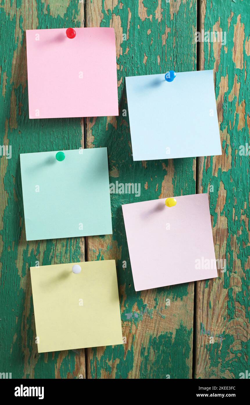 Empty paper stickers on old green wooden background Stock Photo - Alamy
