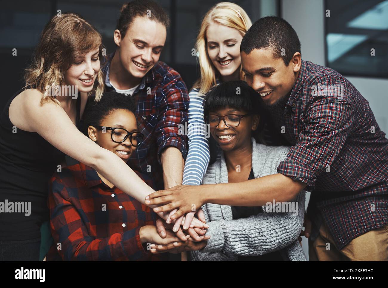 Working towards their collective goals. a group of young designers ...