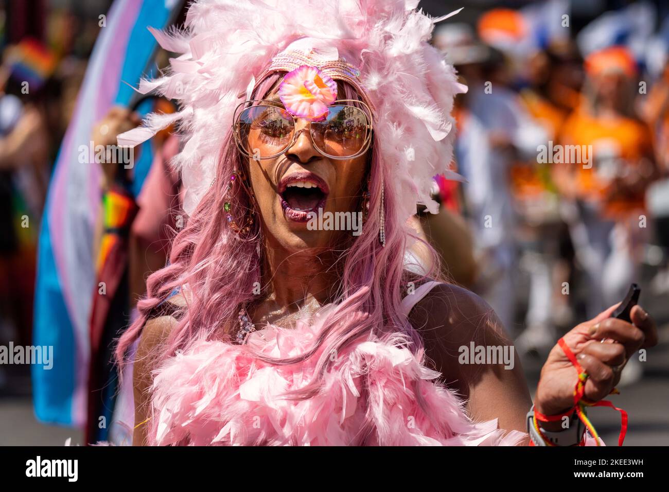 A woman in a pink dress during the LGBTQ pride celebration Stock Photo ...