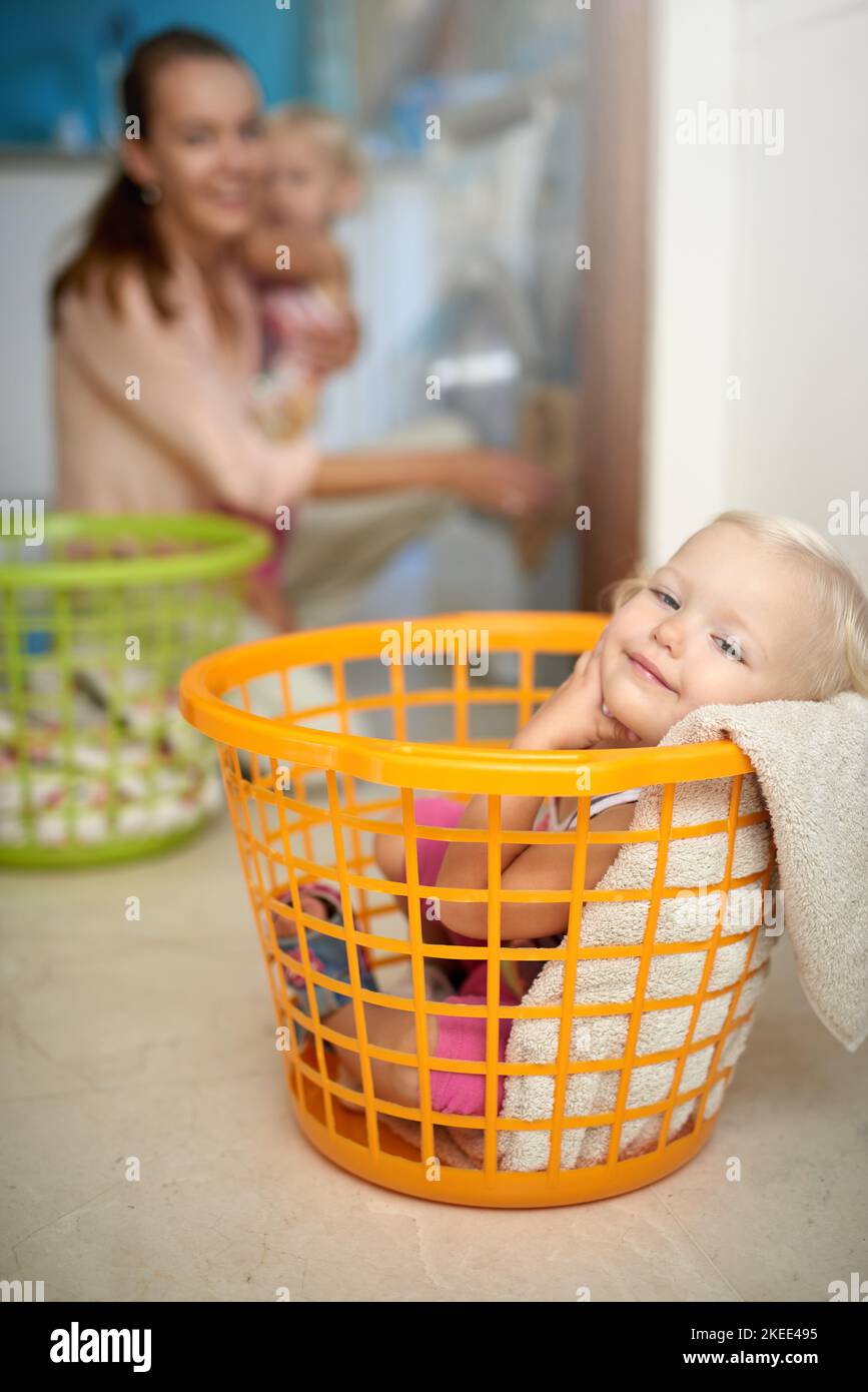 The cutest little helpers. Portrait of a mother and her daughters ...