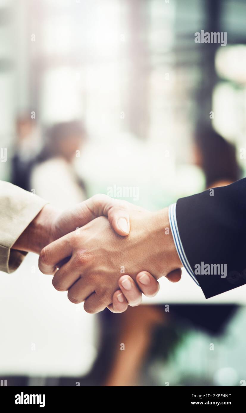 Congratulations and welcome. businesspeople shaking hands in an office ...
