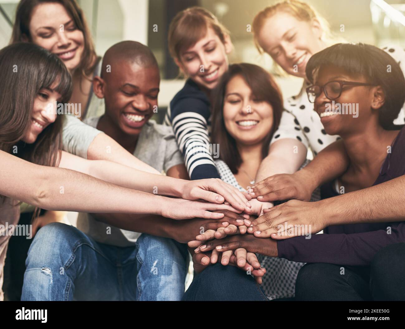 The true definition of a team. Low angle shot of a group of young ...