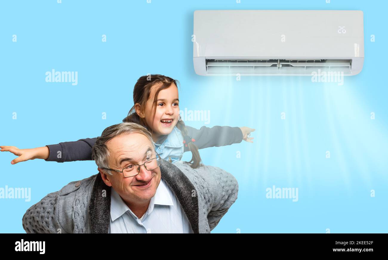 Happy Family Under Air Conditioning Stock Photo - Alamy