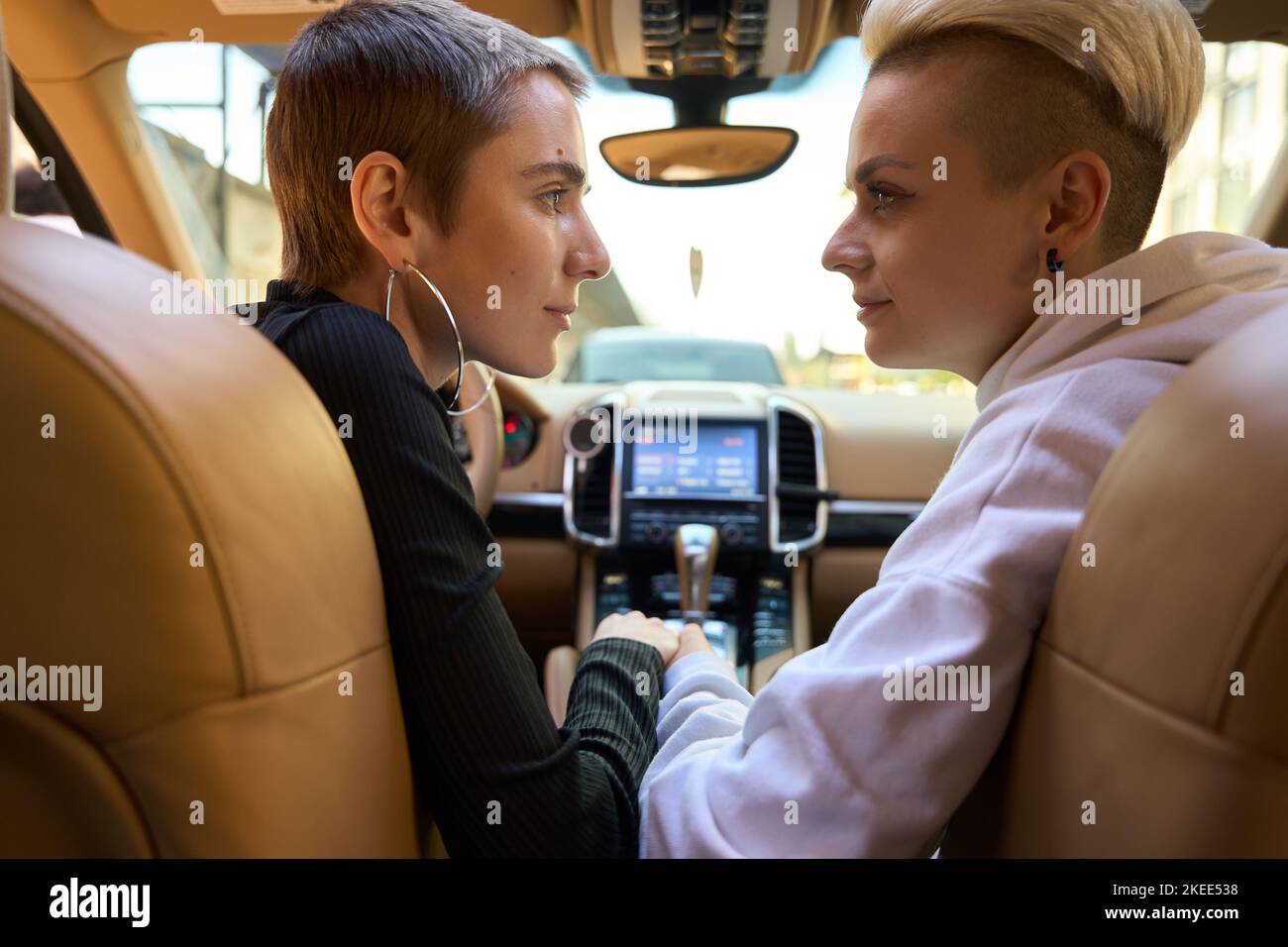 Female LGBT couple sits in a beautiful car Stock Photo - Alamy