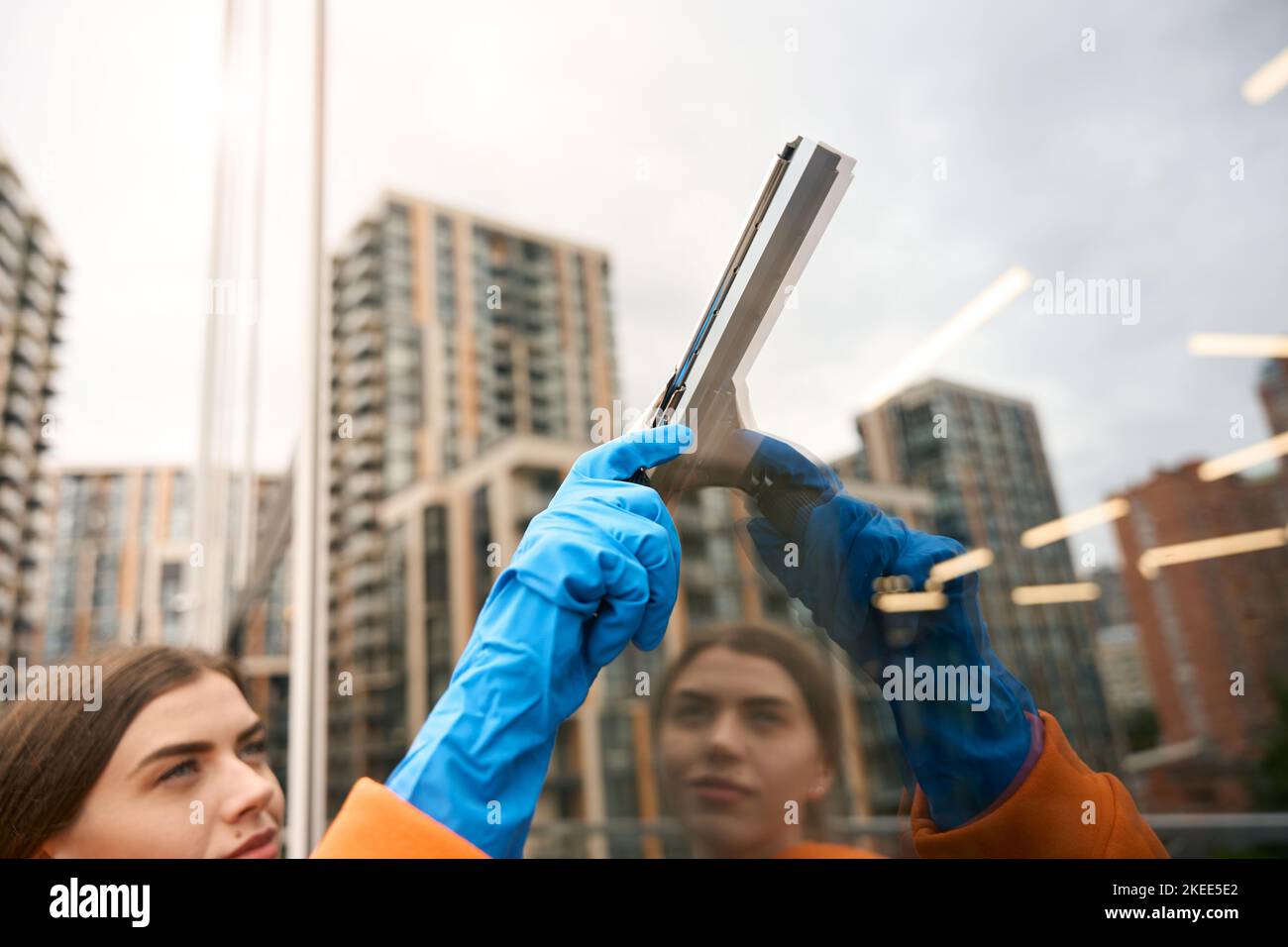 Professional cleaning service worker washes hi-res stock photography ...