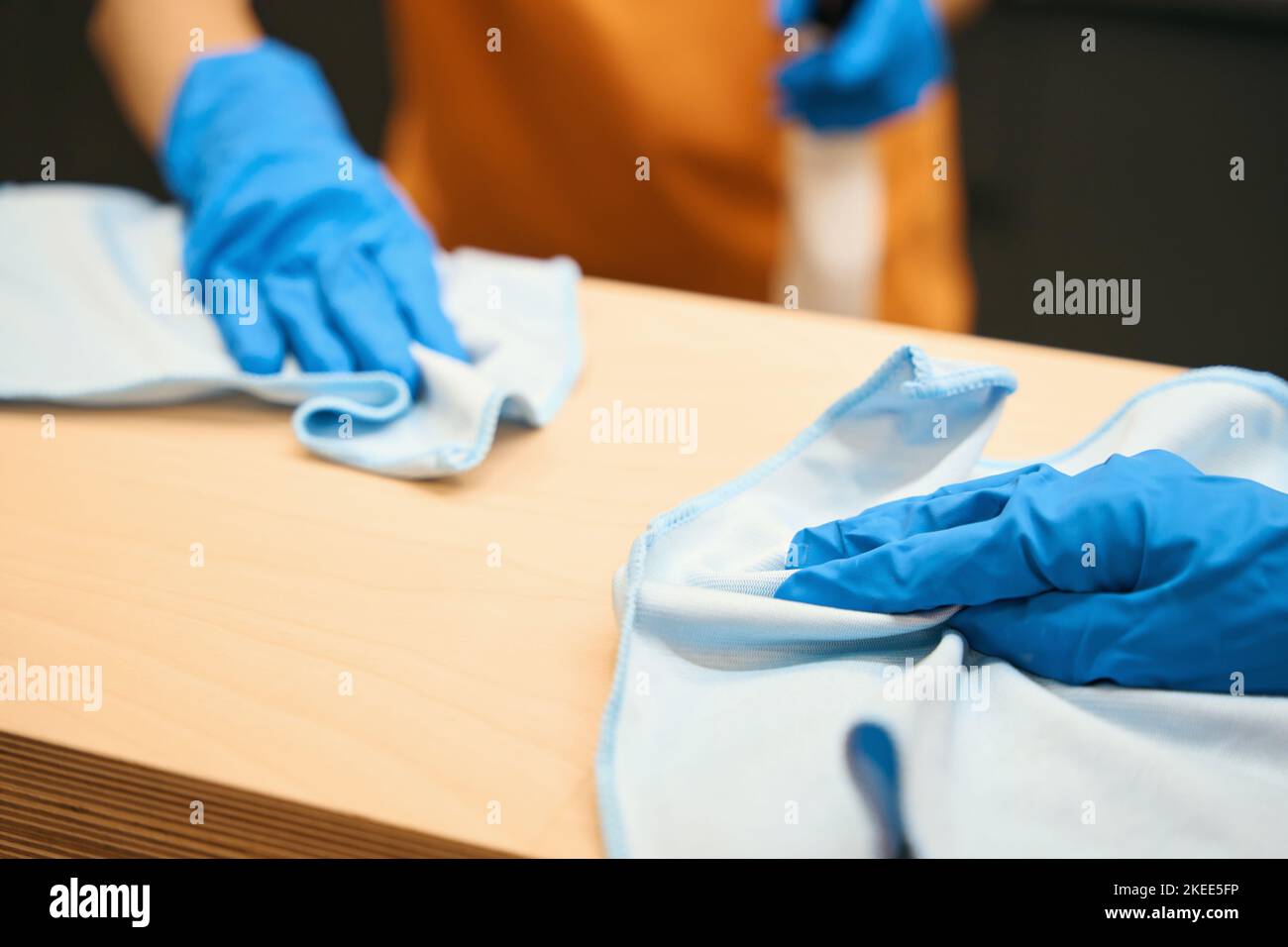 Process of cleaning and disinfecting a table in coworking space Stock ...