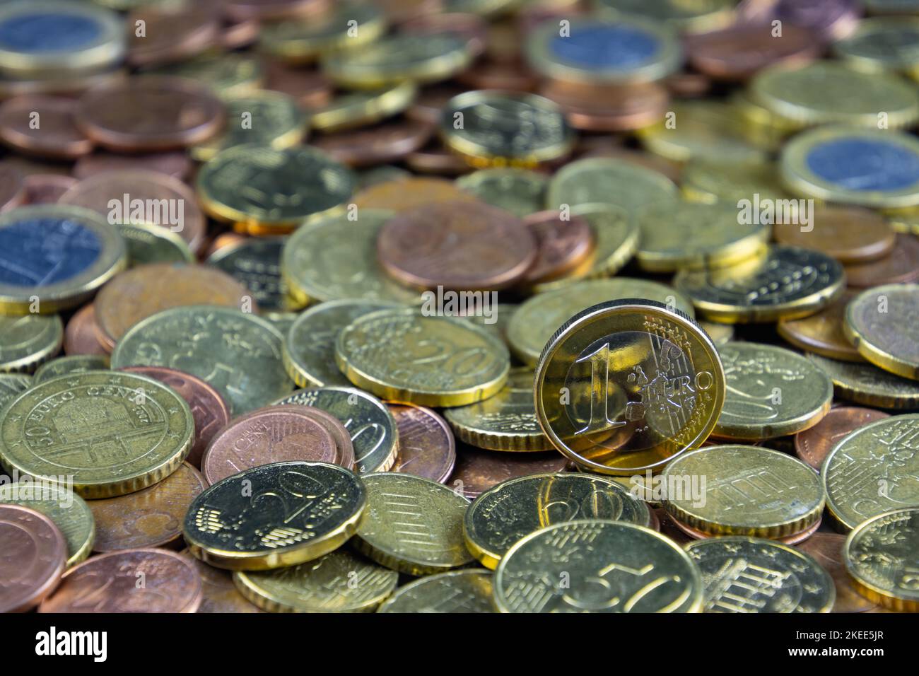 Many euro coins for financial background with focus on 1 euro coin ...