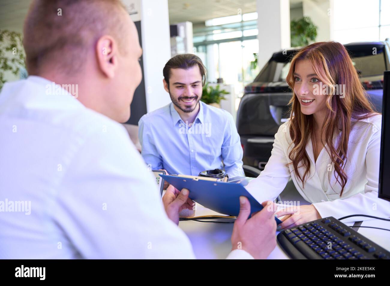 Woman purchasing automobile hi-res stock photography and images - Alamy