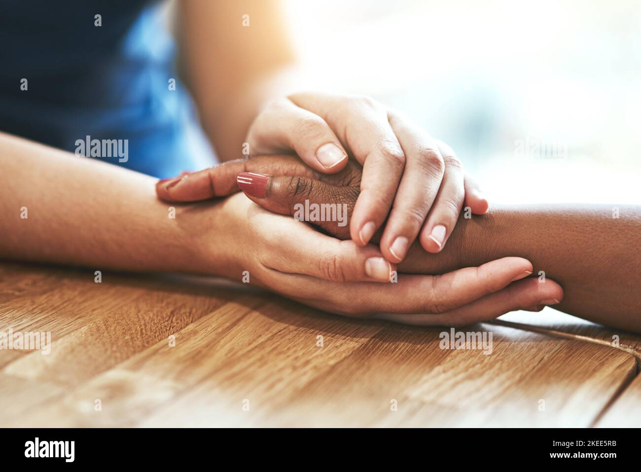 You hand is safe with mine. two people holding hands in comfort Stock ...