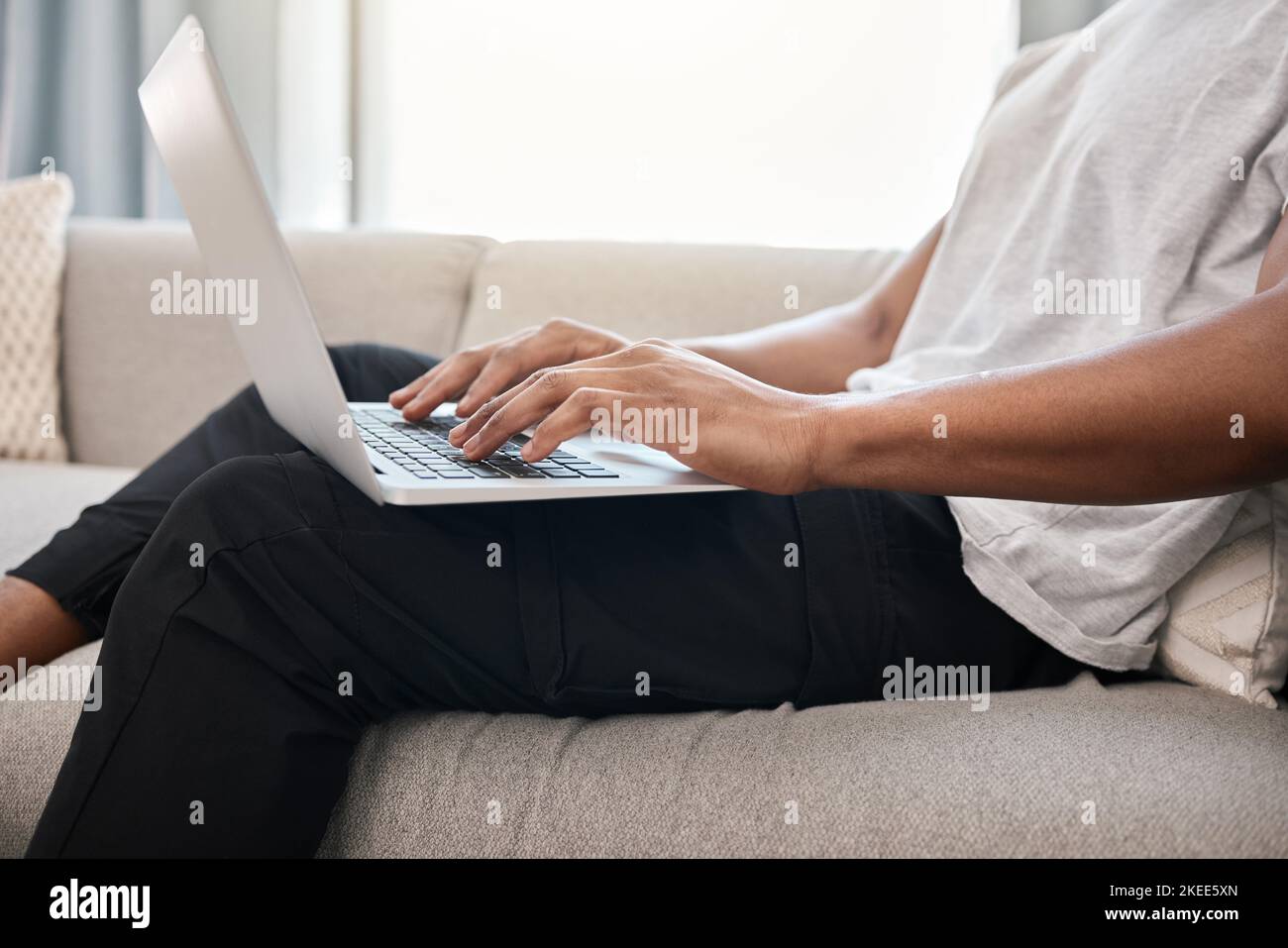 Laptop, home and hands of black man typing email, social media content ...