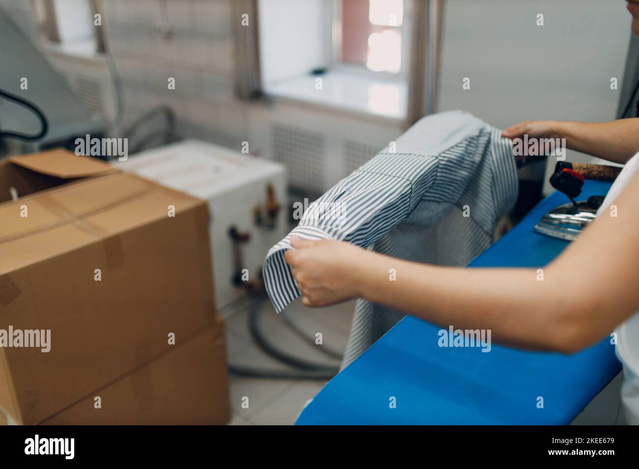 Dry cleaning clothes. Clean cloth chemical process. Laundry industrial ...