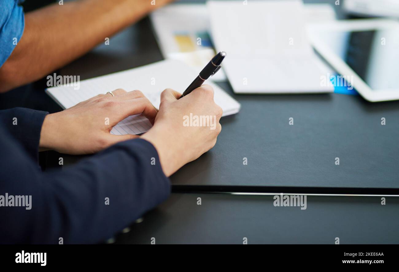 Signing off on the deal. High angle shot of an unrecognizable ...