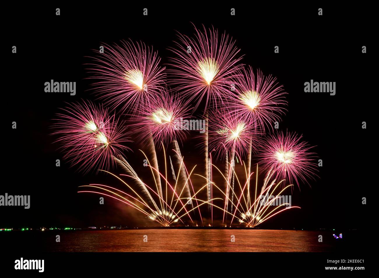 Firework celebration from the sea shore. Colorful fireworks celebration ...