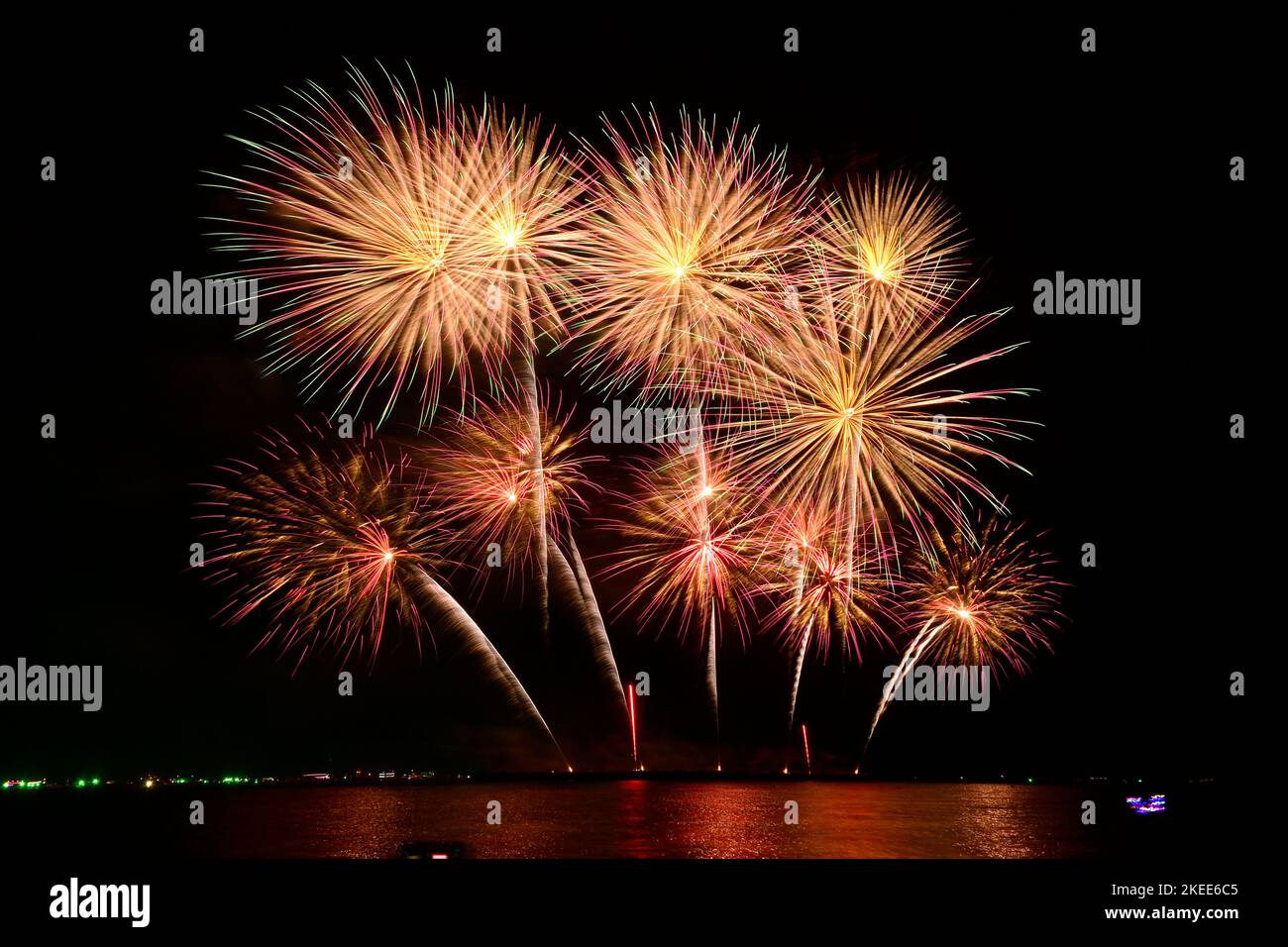 Firework celebration from the sea shore. Colorful fireworks celebration ...