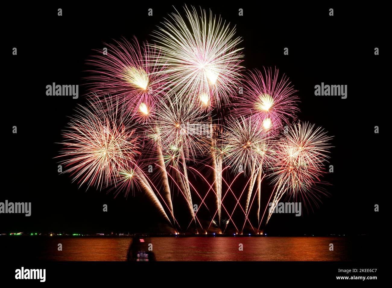 Firework celebration from the sea shore. Colorful fireworks celebration ...