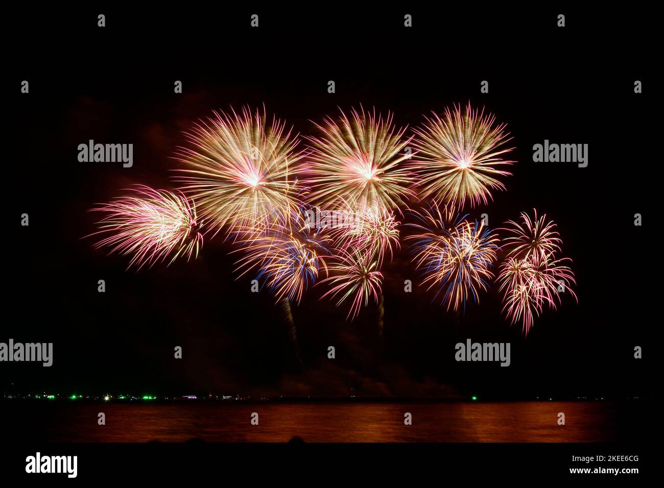 Firework celebration from the sea shore. Colorful fireworks celebration ...