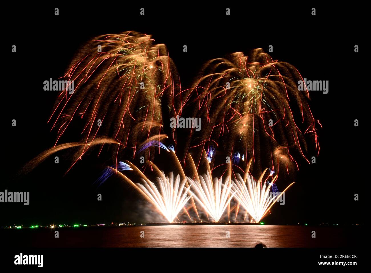 Firework celebration from the sea shore. Colorful fireworks celebration ...